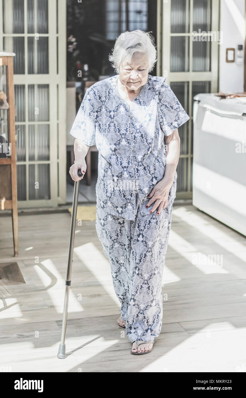 Portrait of a obaasan (grandma) with difficulty to walk because of the ...