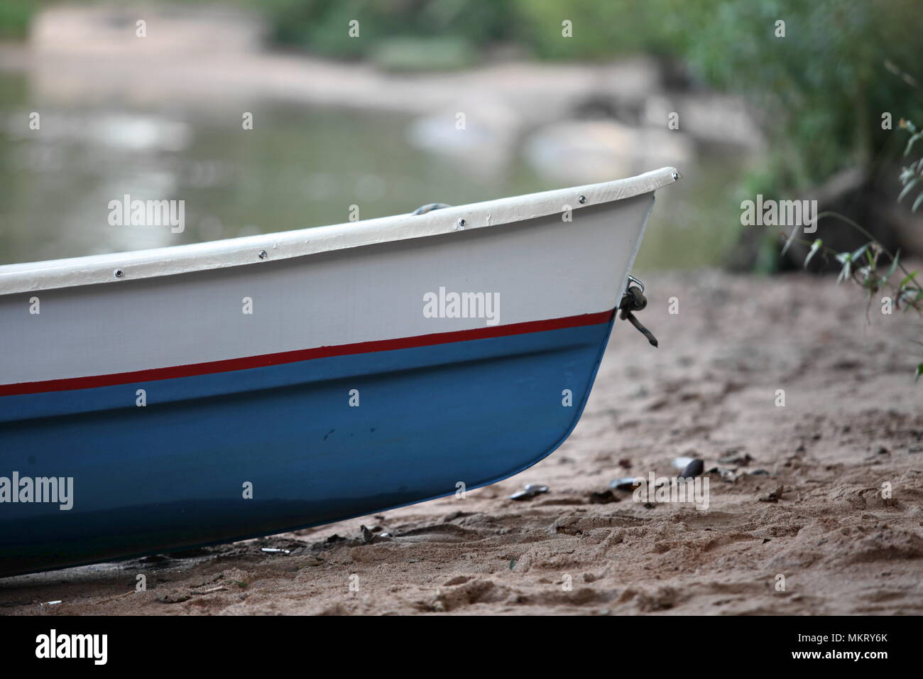 landscape with a rowing boat on the beach Stock Photo - Alamy