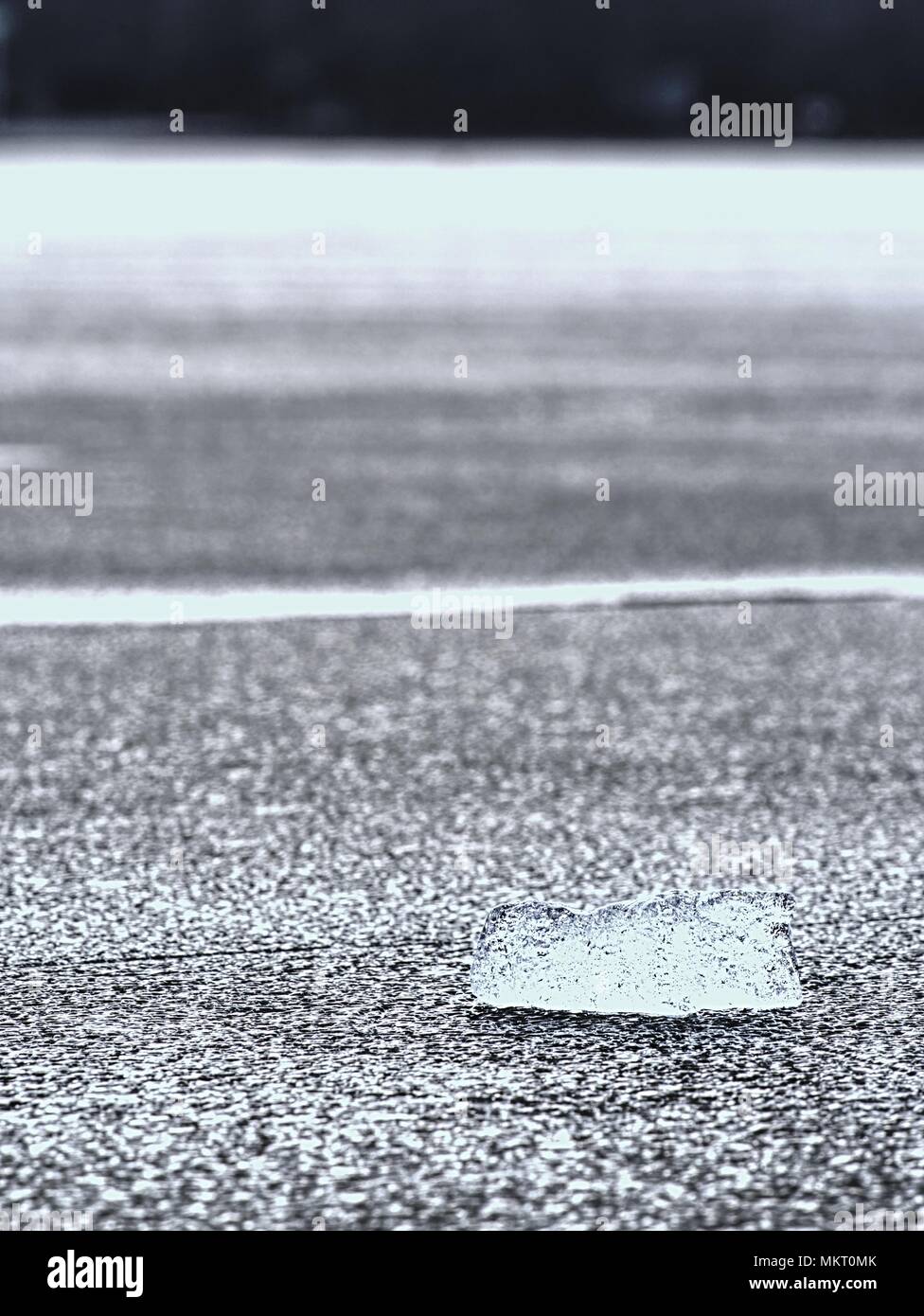 Detail of frozen icy sheet. Ice cracks forming surface, floes flowing ...