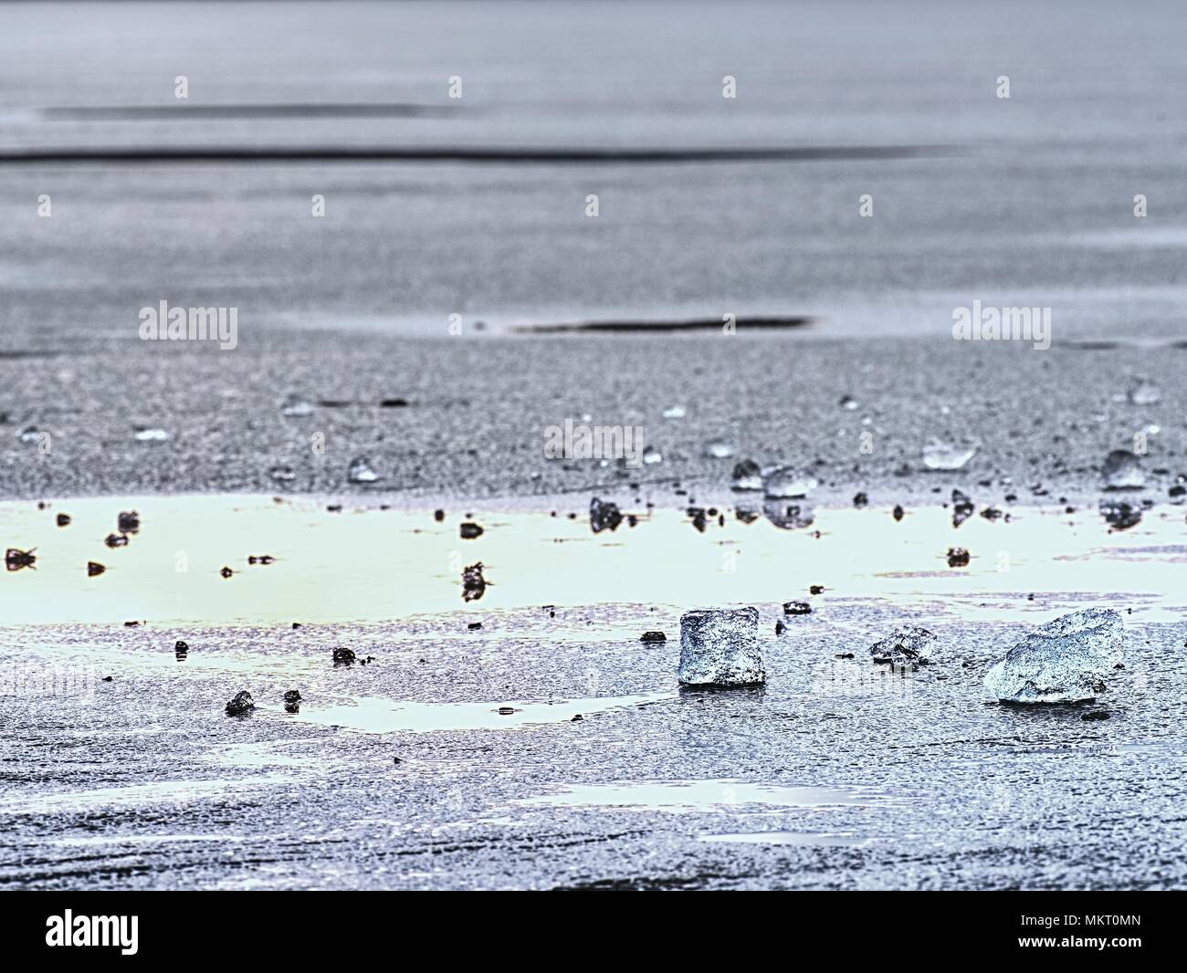 Winter coastal under icy cover. Icy andscape with broken pieces of blue ...