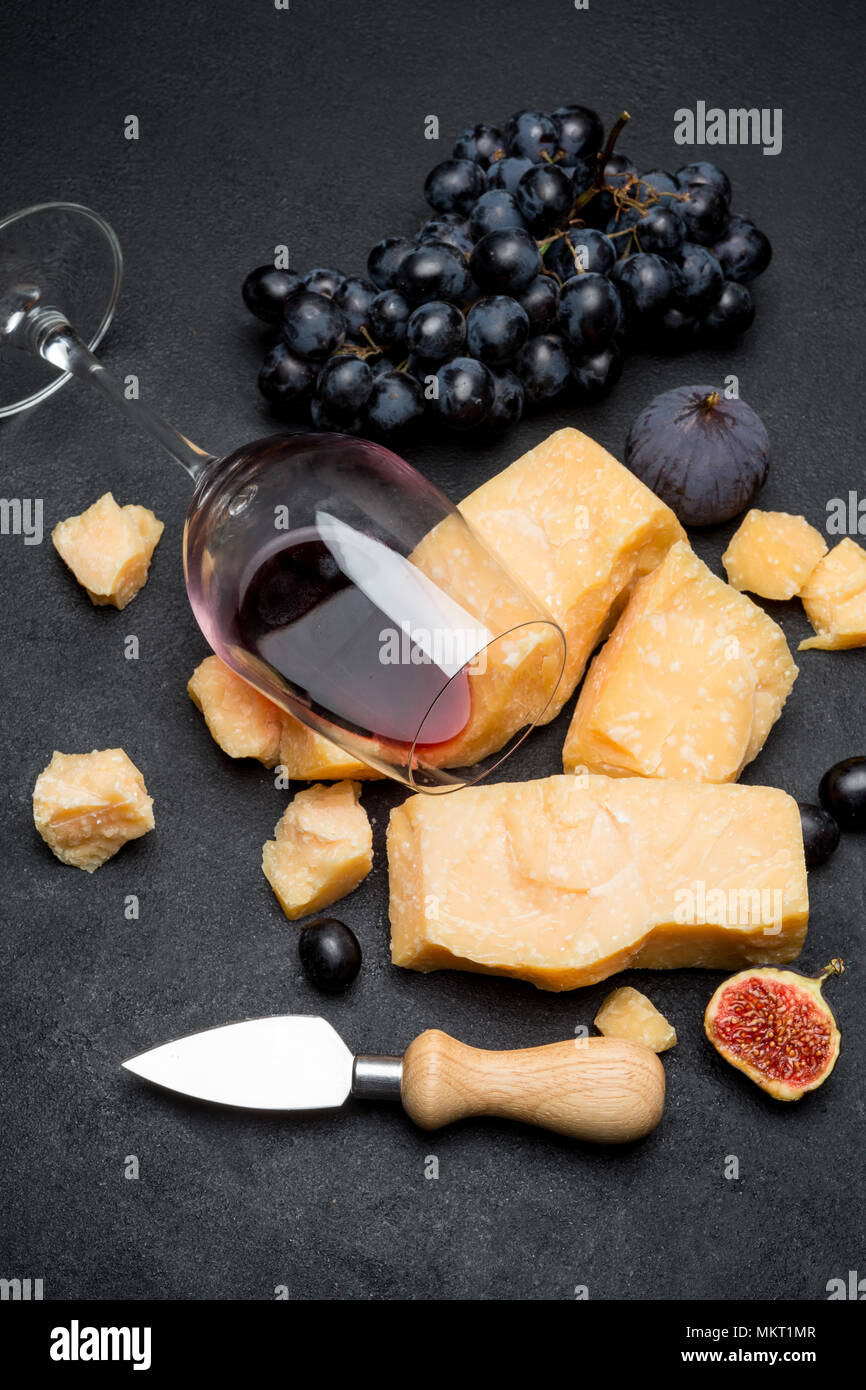 pieces of parmesan or parmigiano cheese, wine and grapes Stock Photo ...