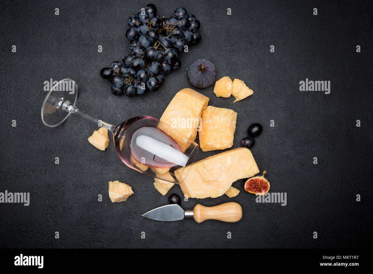 pieces of parmesan or parmigiano cheese, wine and grapes Stock Photo ...