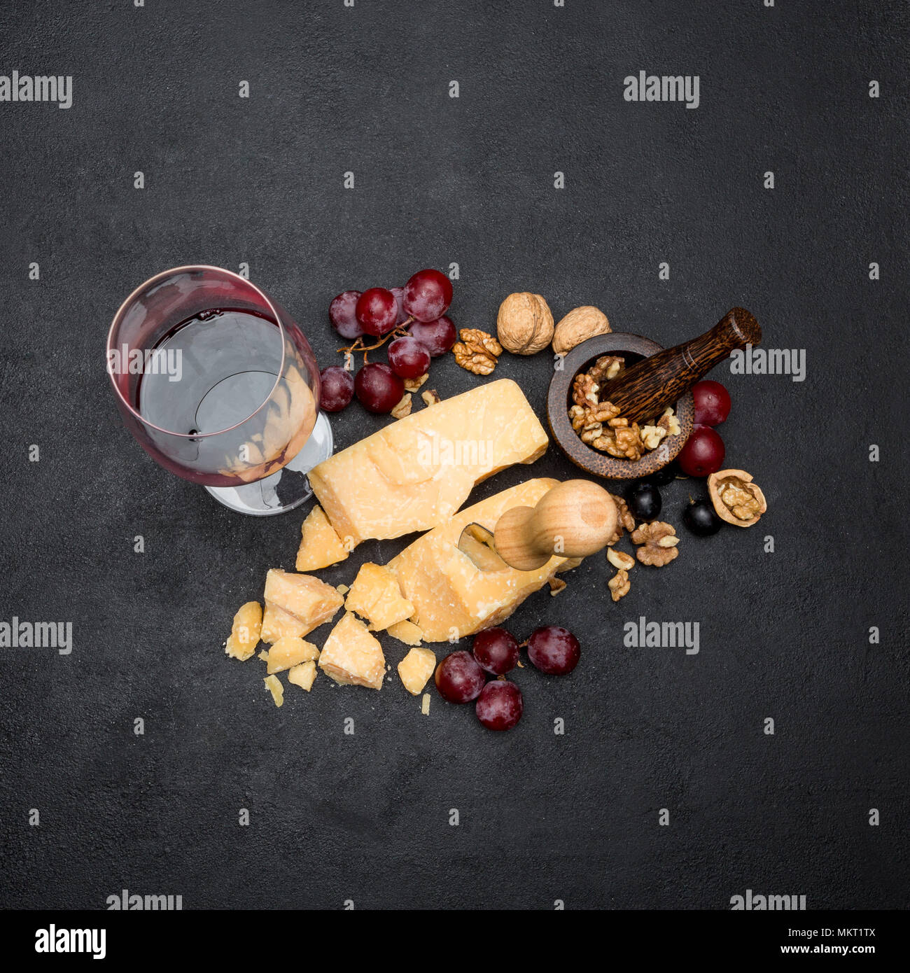 pieces of parmesan or parmigiano cheese, wine and grapes Stock Photo ...