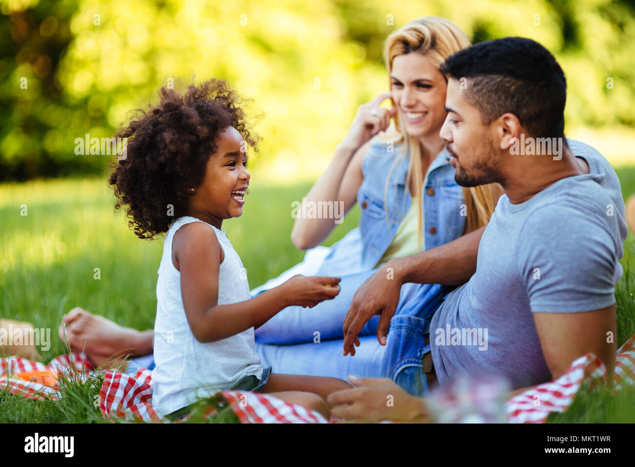 Happy family having fun time on picnic Stock Photo - Alamy