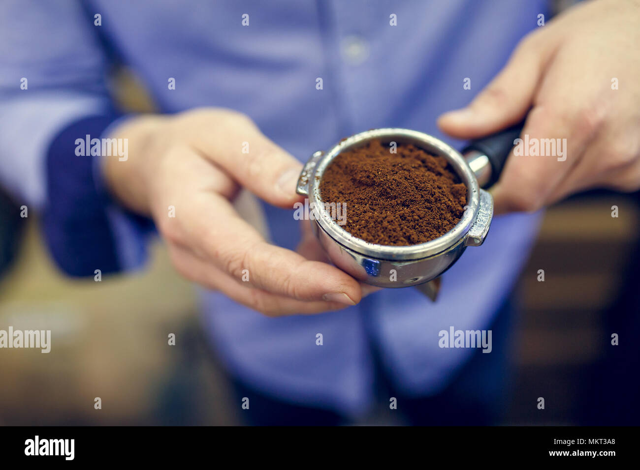 Imageof barista man with ground coffee in hands Stock Photo - Alamy