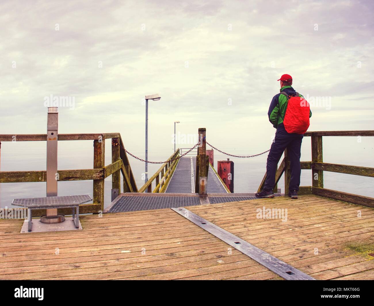 Wooden pier in summer holiday destination. Late summer landscape with ...