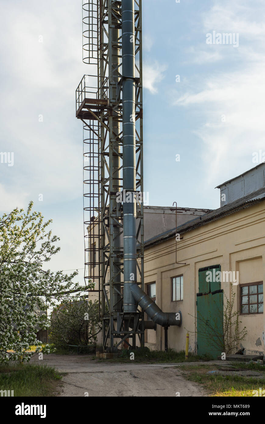 Metal pipe with a ladder Stock Photo - Alamy