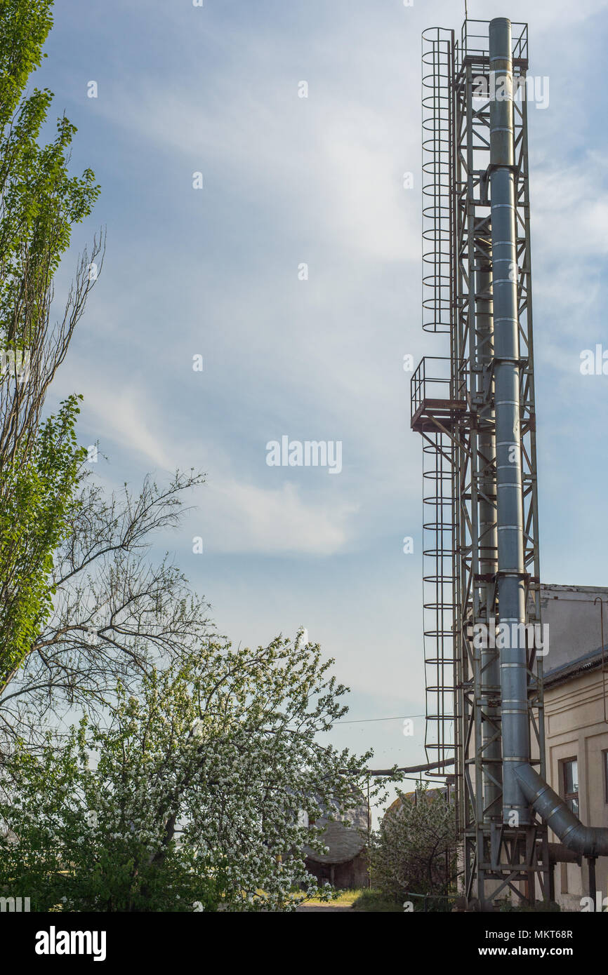 Metal pipe with a ladder Stock Photo - Alamy