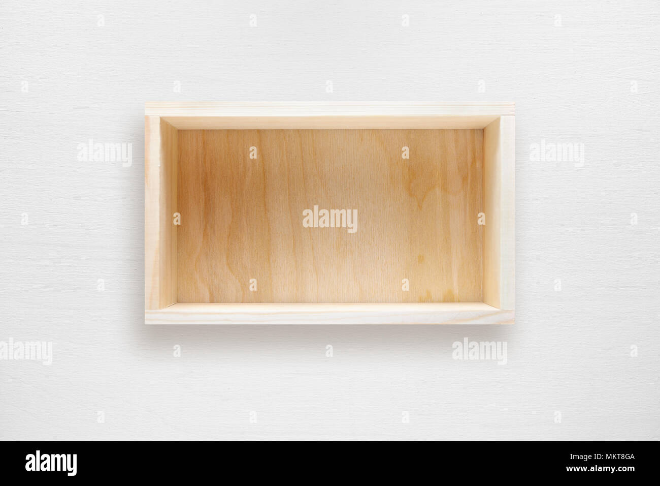 Wooden box on white table top view Stock Photo - Alamy