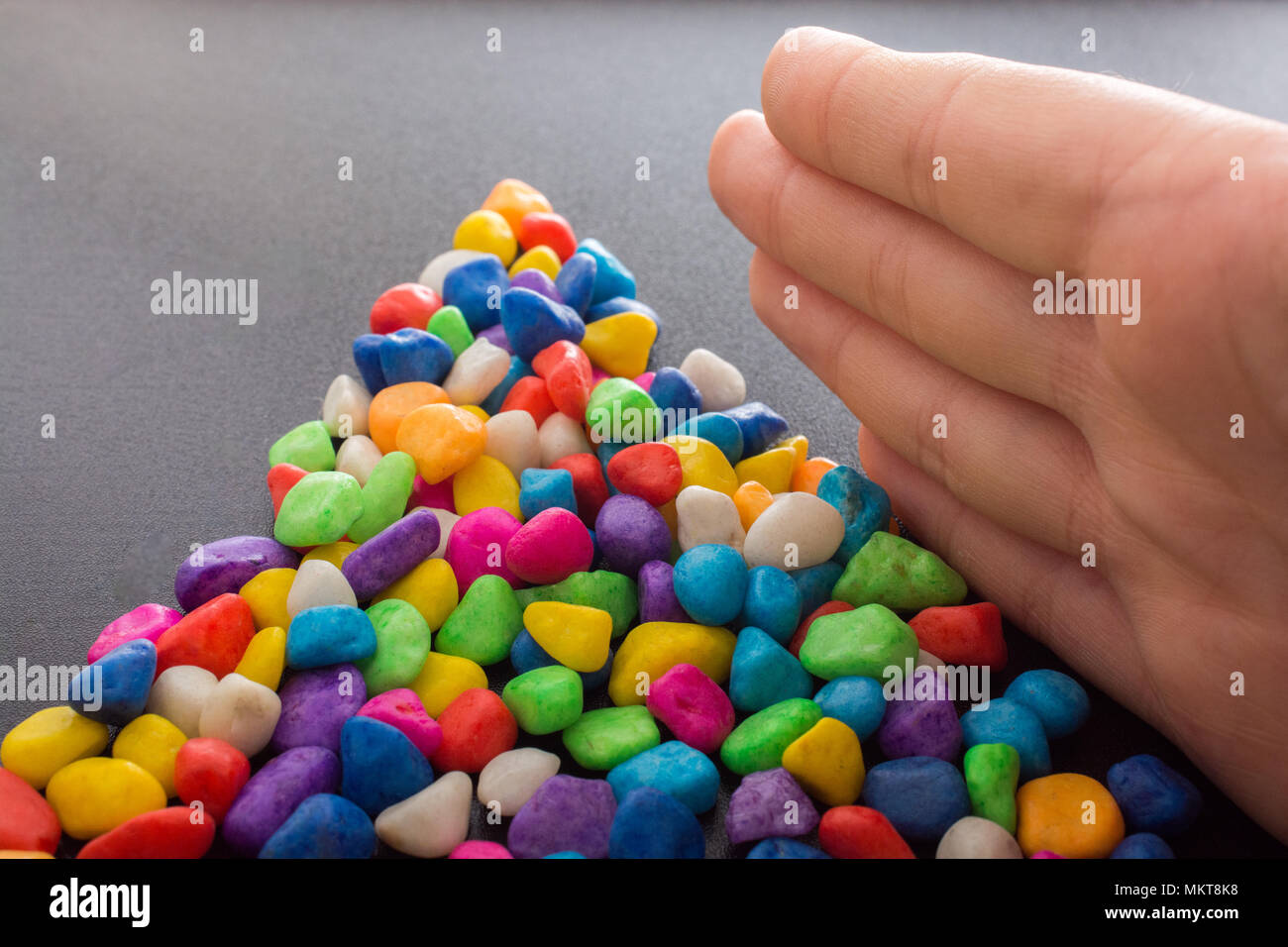 Pile of little colorful pebbles as stone background Stock Photo - Alamy