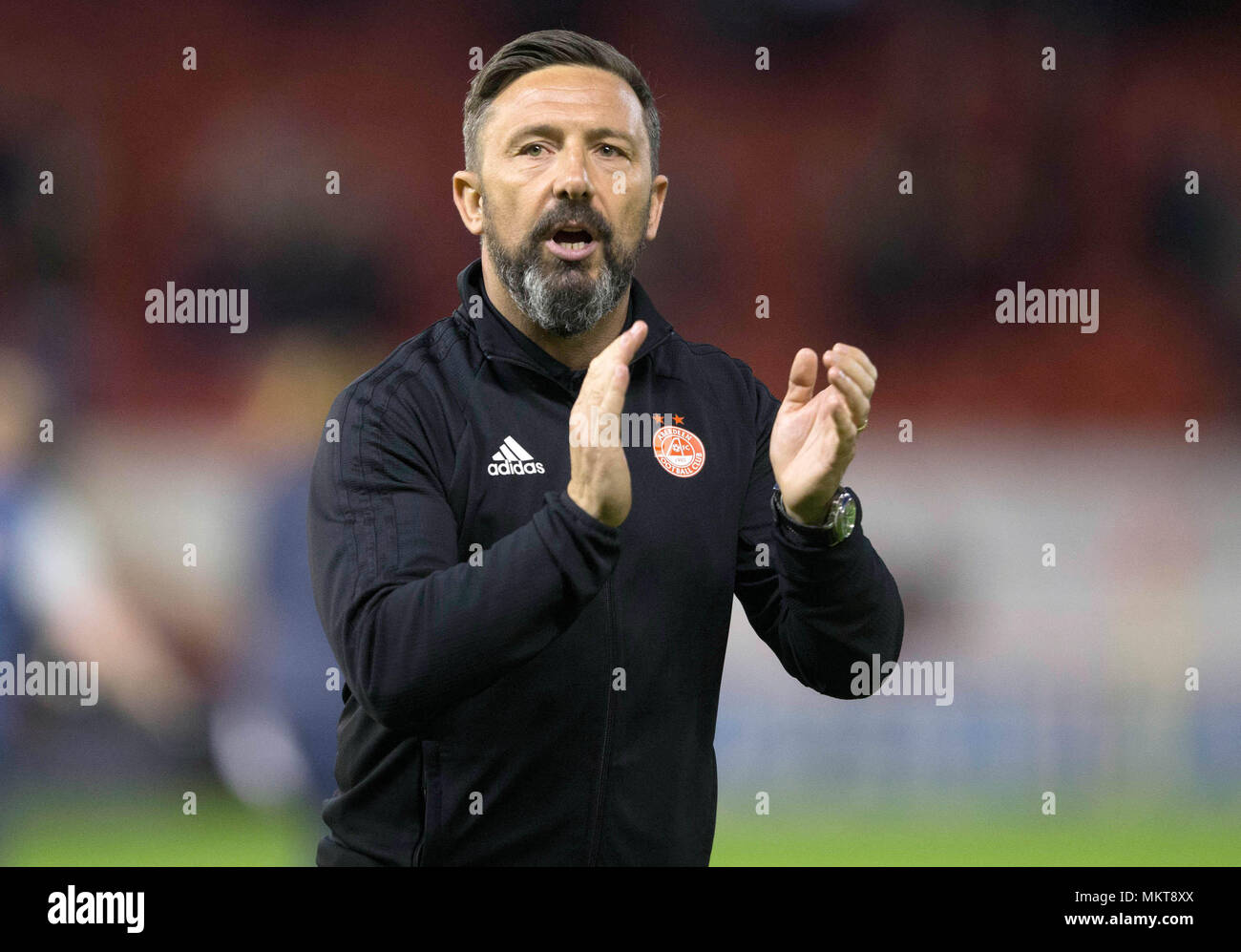Aberdeen manager Derek McInnes salutes the fans at the end of the ...