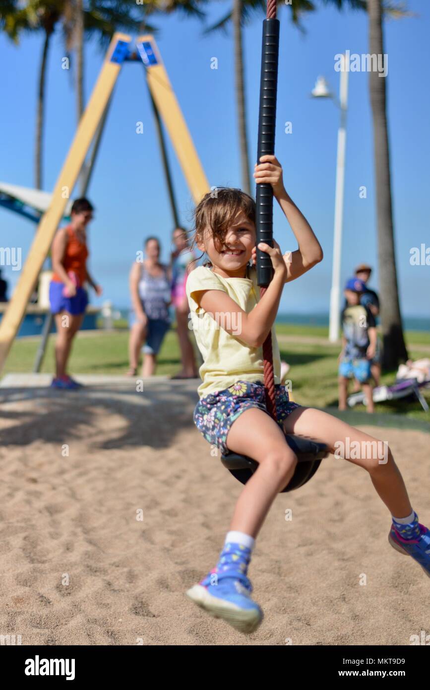 Child riding on a flying fox, near the rockpool and Jezzine barracks ...