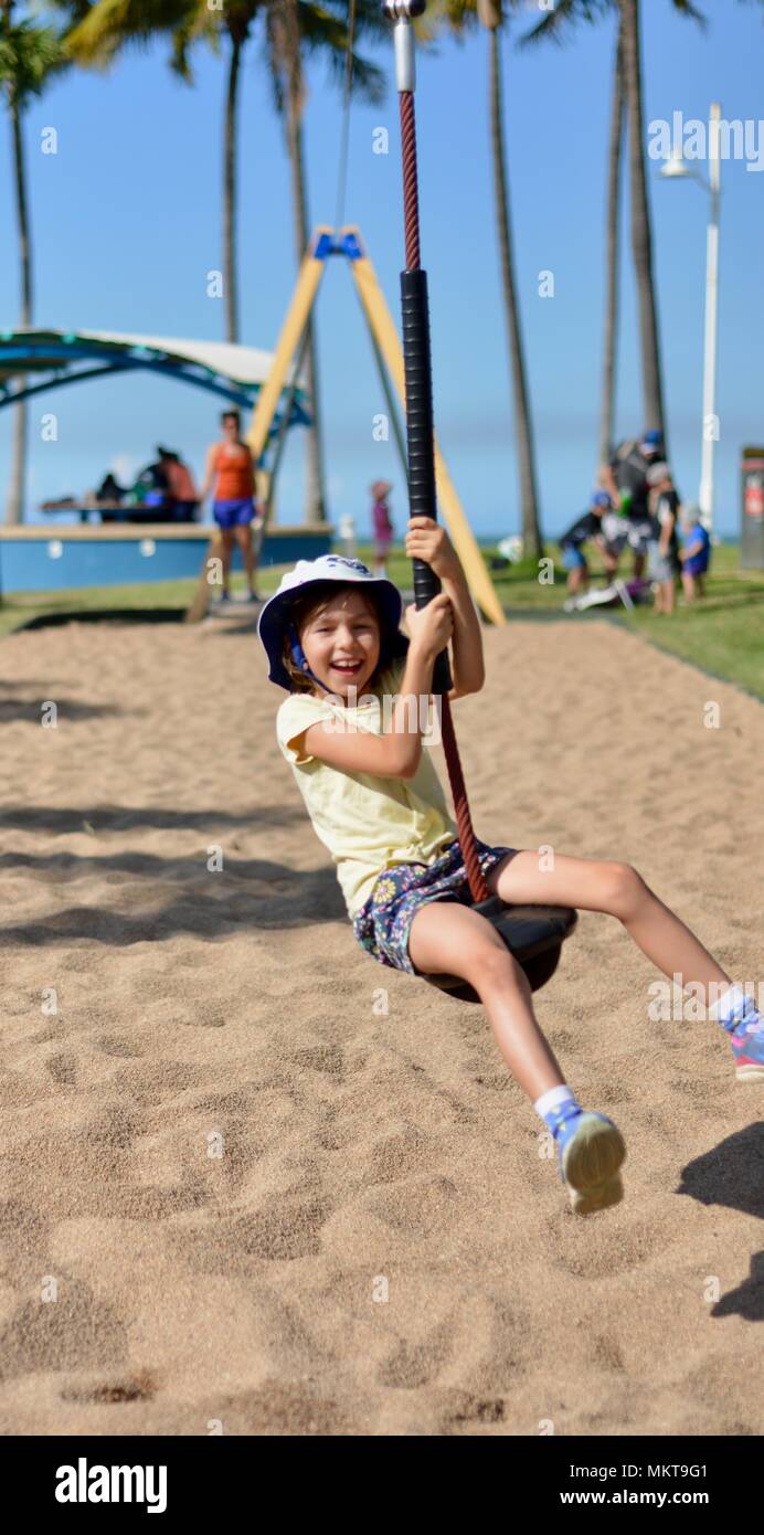 Child riding on a flying fox, near the rockpool and Jezzine barracks ...