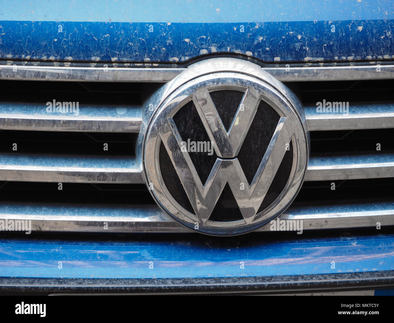 BERLIN, GERMANY - CIRCA APRIL 2018: the Volkswagen sign on a blue car ...