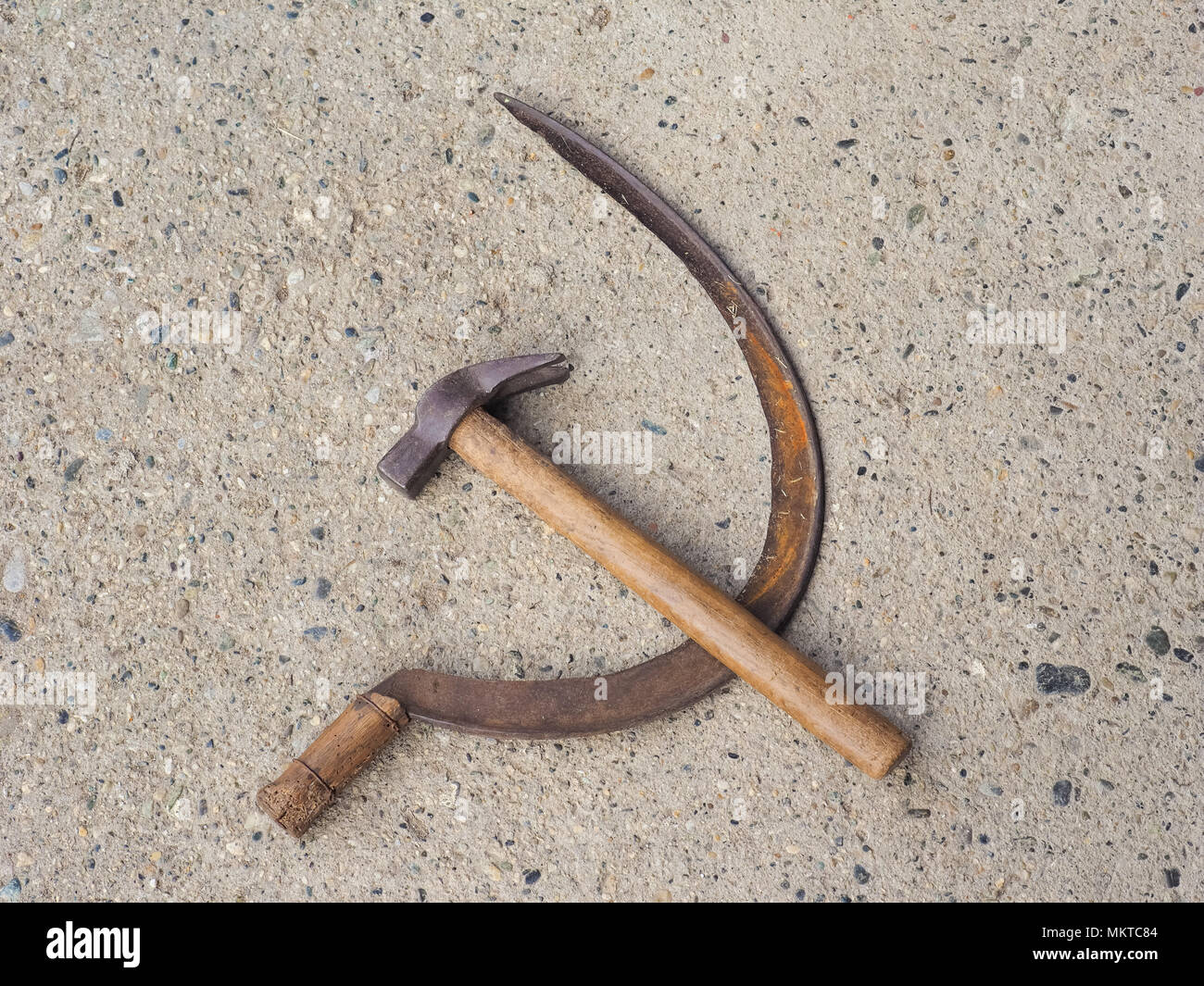 hammer and sickle symbol of communism over concrete Stock Photo - Alamy