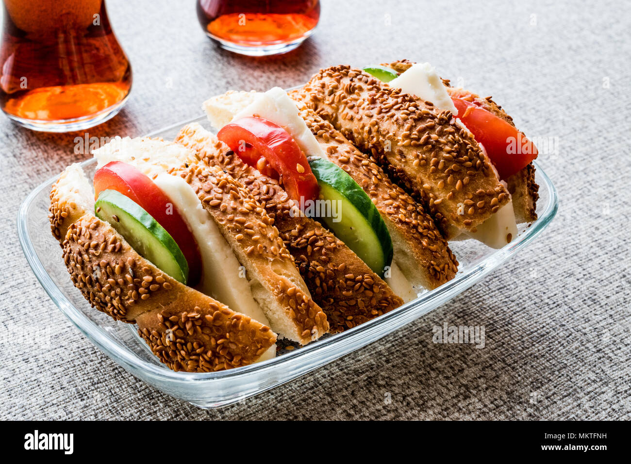 Turkish Bagel Simit Sandwich with cheese, tomato, cucumber and tea ...
