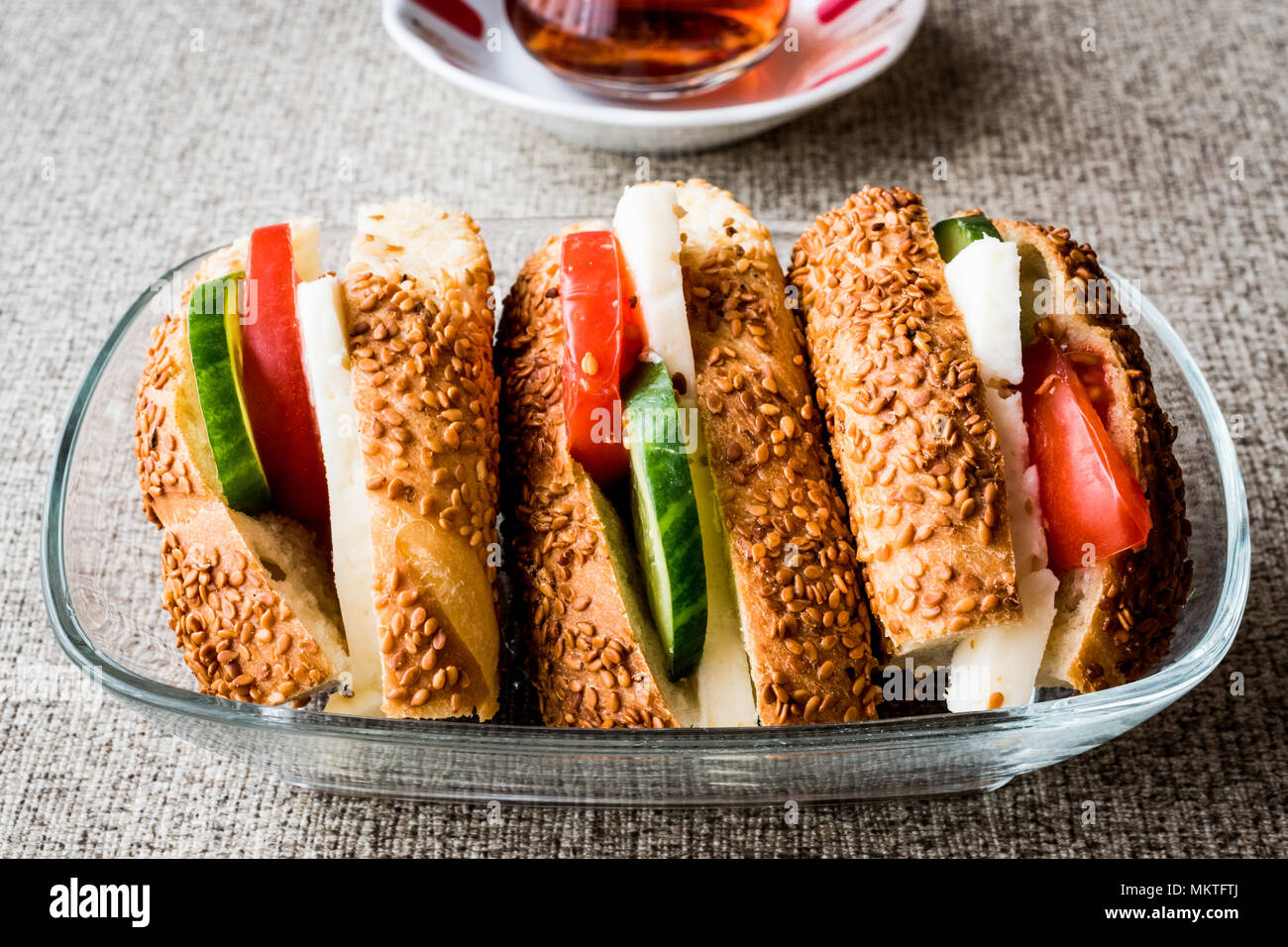 Turkish Bagel Simit Sandwich with cheese, tomato, cucumber and tea ...