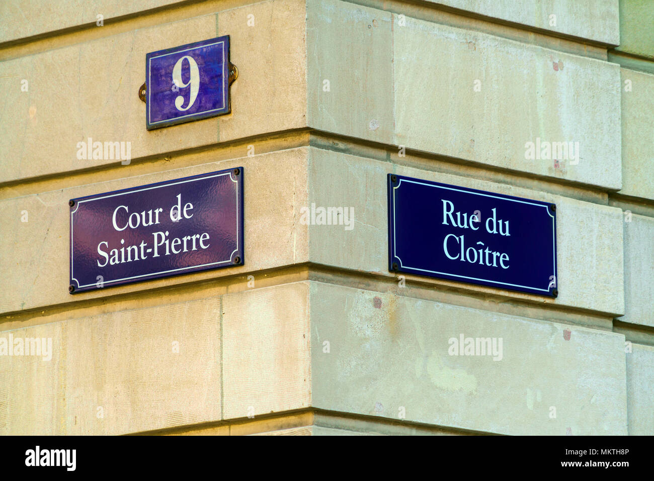 Typical street signs on the walls of the houses of the old city, Geneva ...