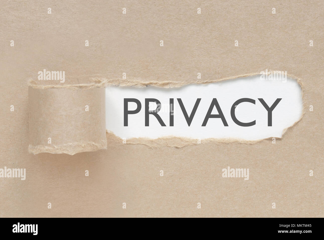 Torn paper revealing the word privacy Stock Photo - Alamy
