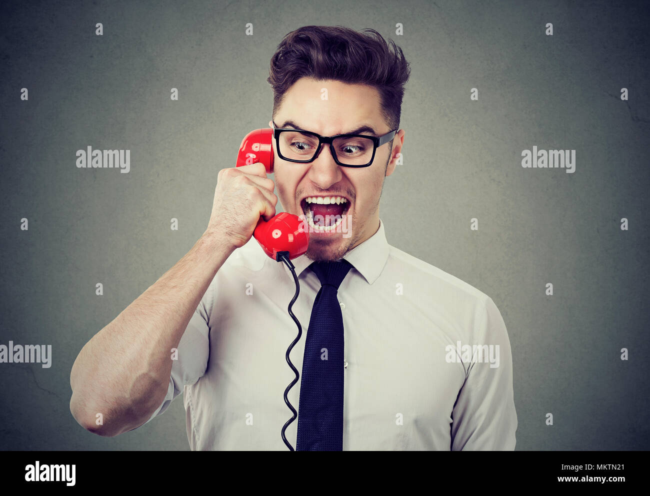 Angry mad business man screaming on the phone Stock Photo - Alamy