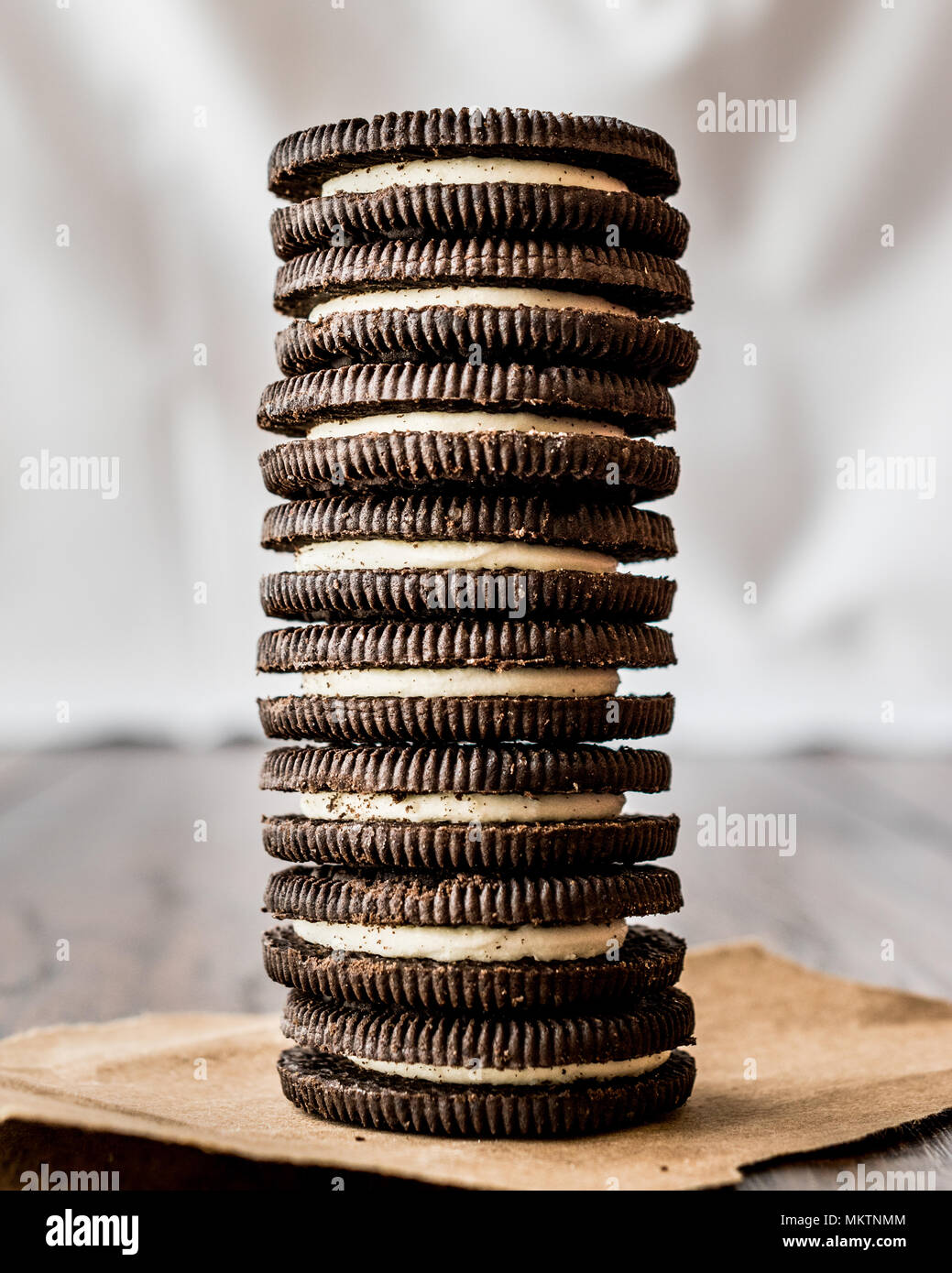 Stack of Chocolate cookies with vanilla cream filling. dessert concept ...