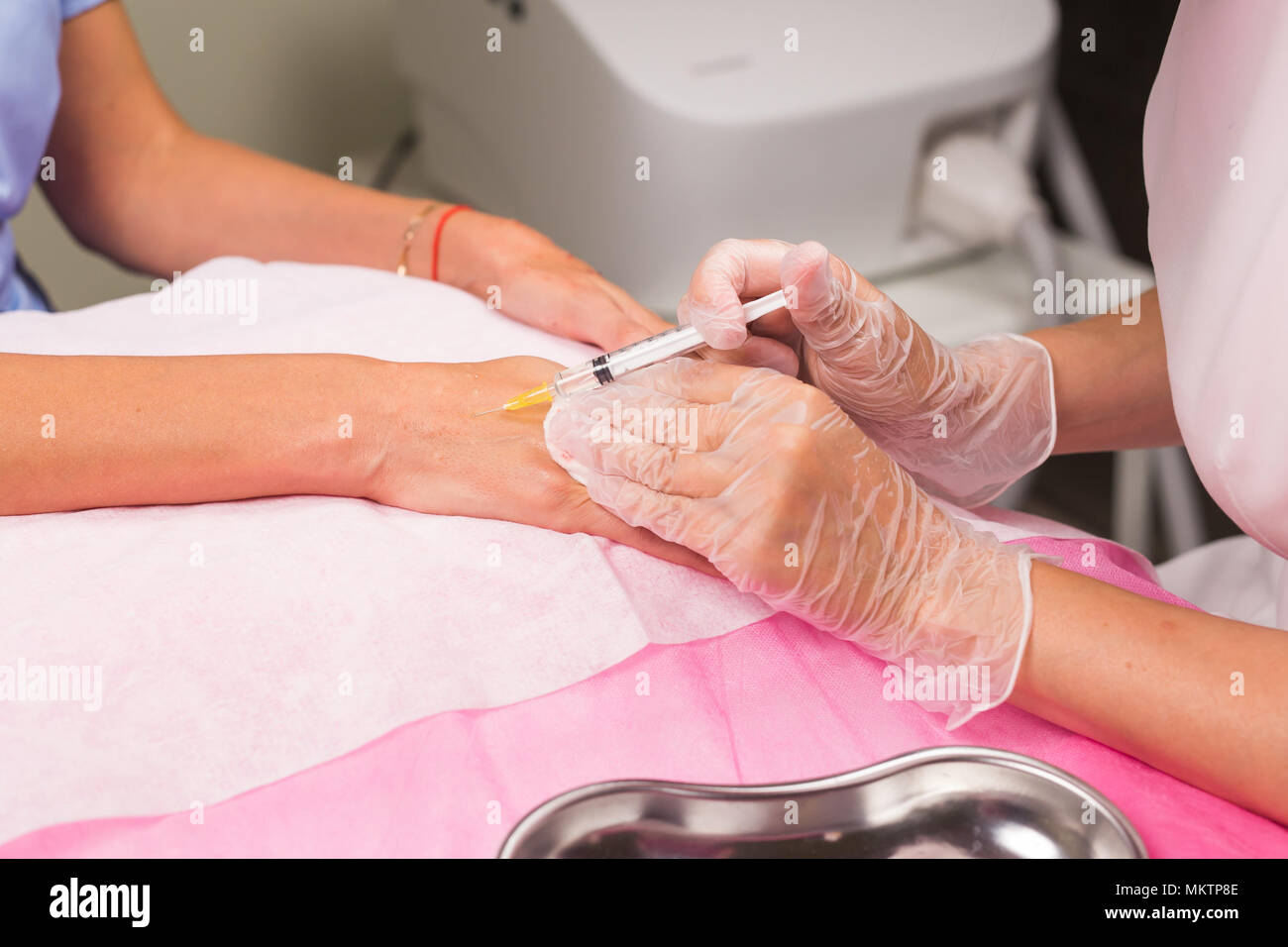 cosmetology and beauty concept - Anti-age injection therapy, hand ...