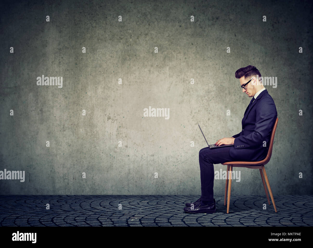 Man sitting side view suit hi-res stock photography and images - Alamy