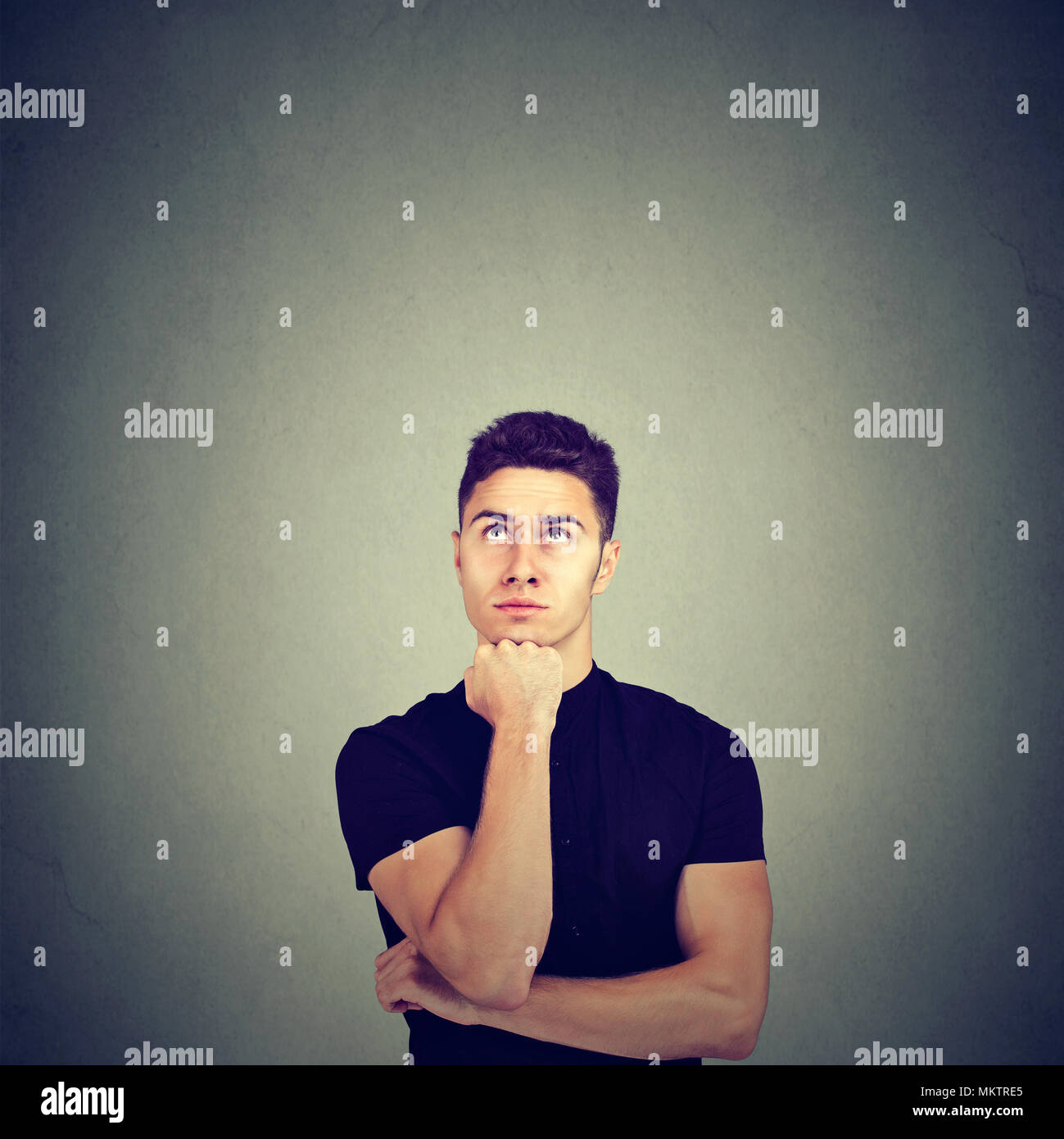 handsome business man thinking looking up Stock Photo - Alamy