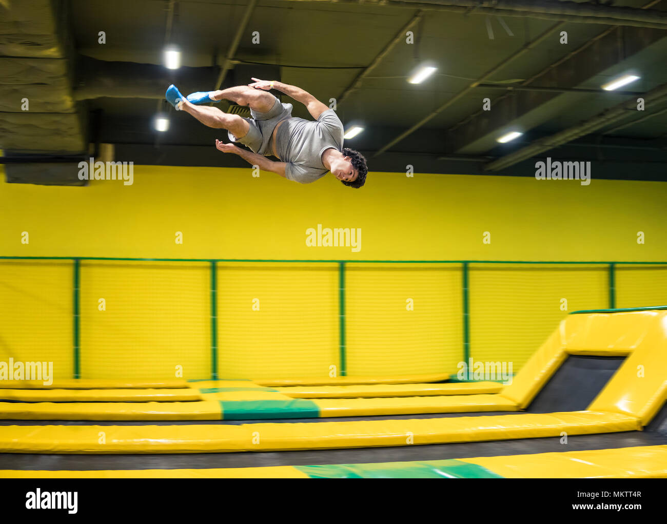 trampoline jumper performs acrobatic exercises on the trampoline Stock ...