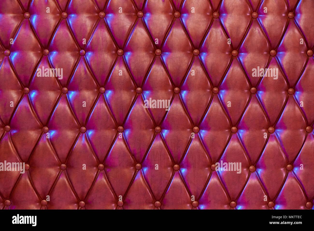 Texture, background red leather with a pattern of rhombus and buttons ...