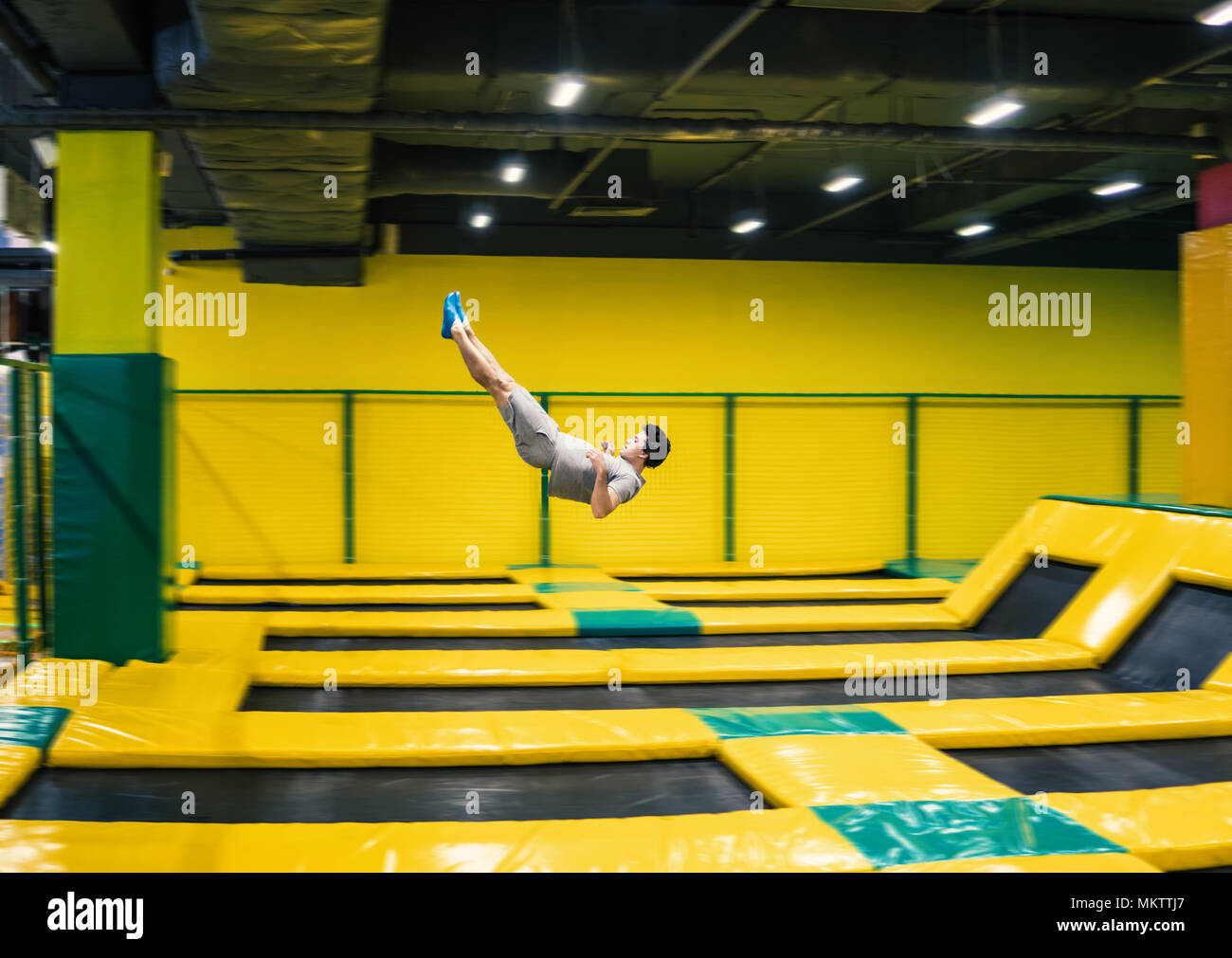 trampoline jumper performs acrobatic exercises on the trampoline Stock ...