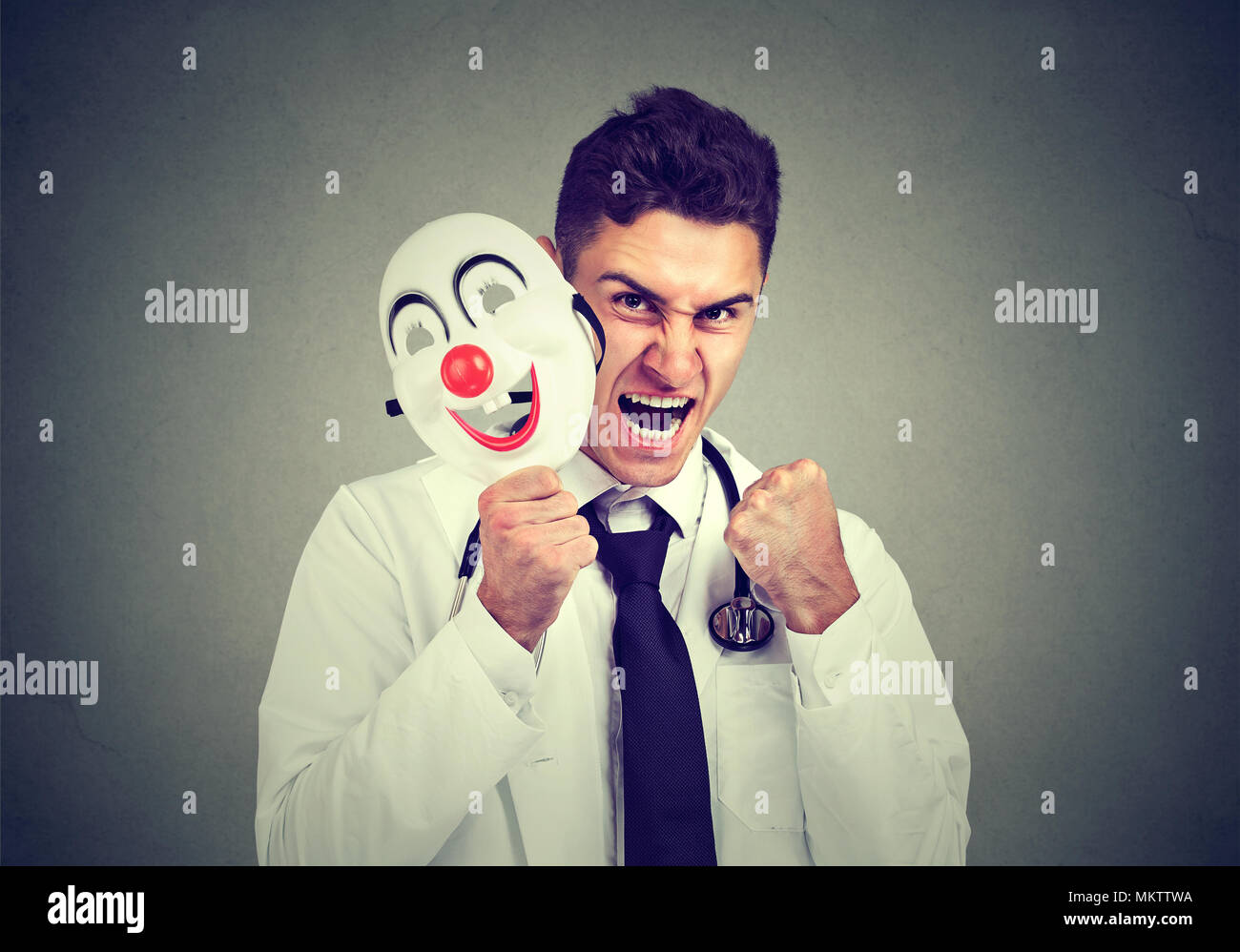 Young man taking off mask hi-res stock photography and images - Alamy