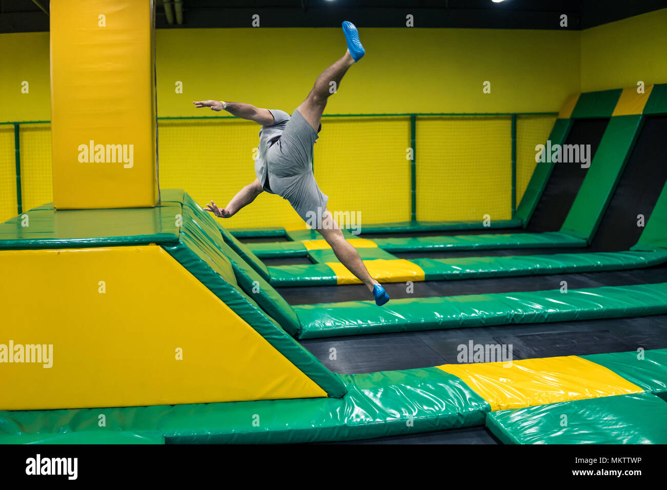 trampoline jumper performs acrobatic exercises on the trampoline Stock ...