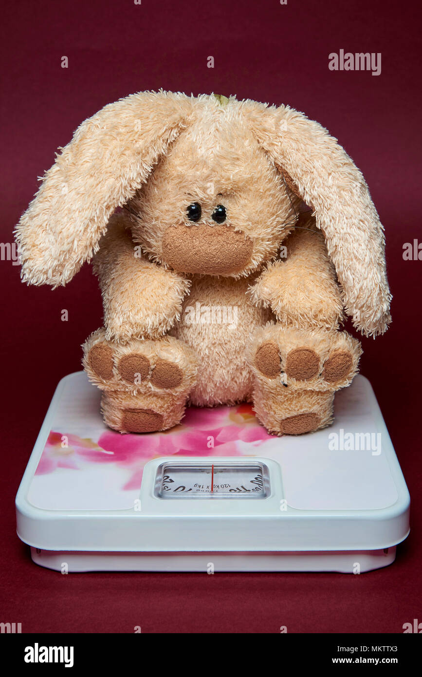 Child on weighing scales hi-res stock photography and images - Alamy