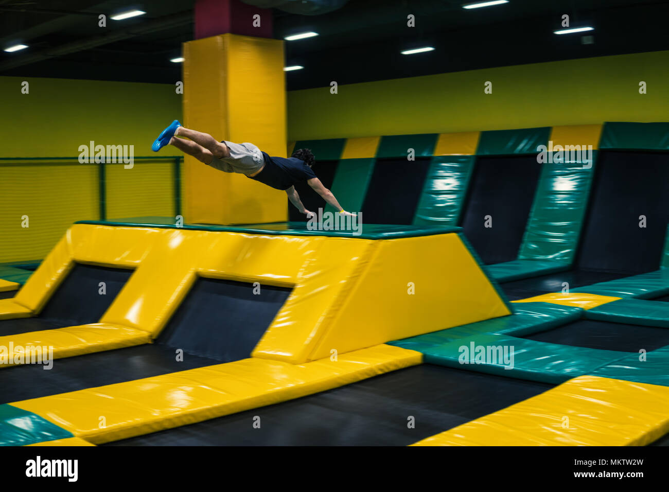 trampoline jumper performs acrobatic exercises on the trampoline Stock ...