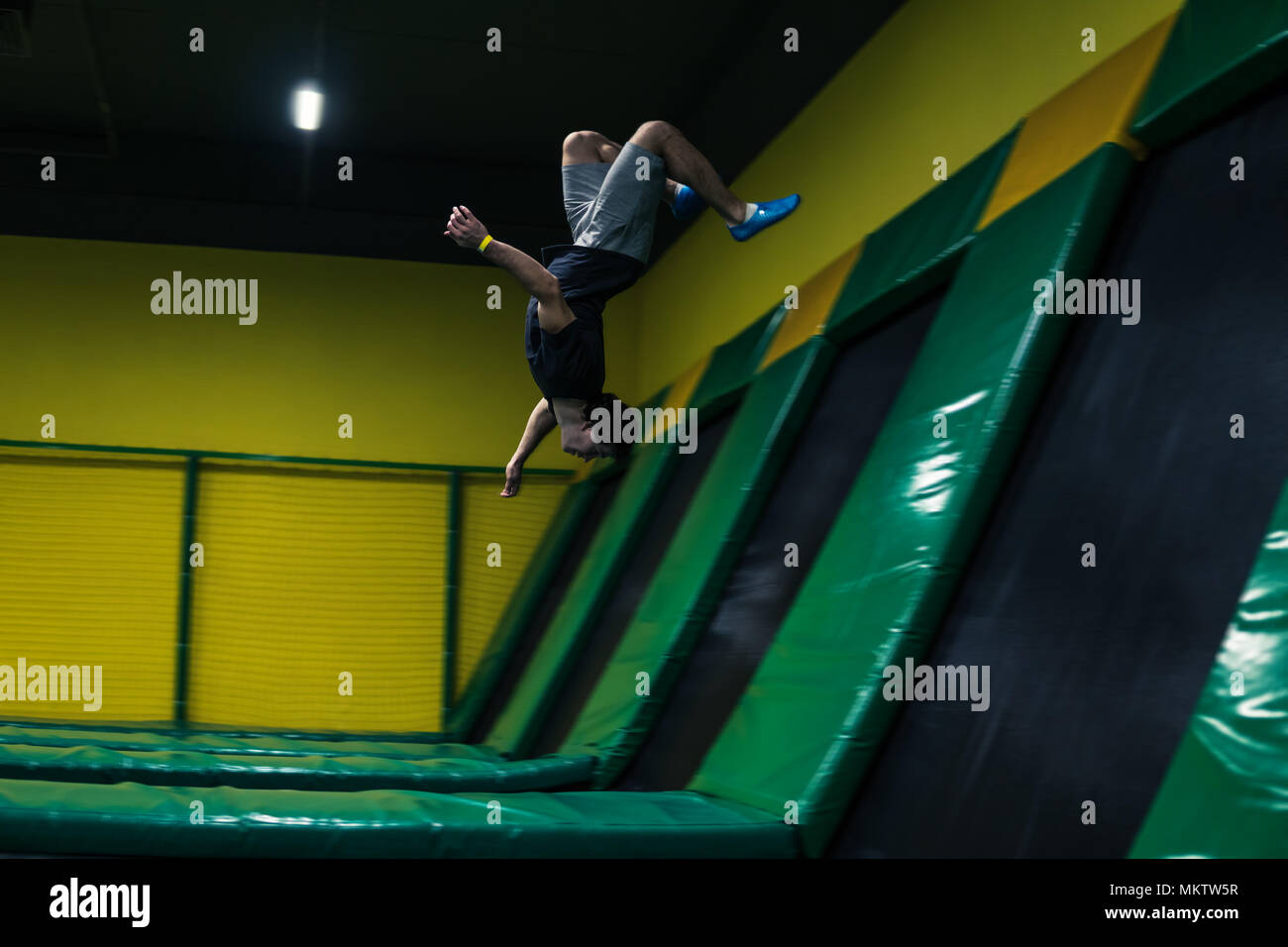 trampoline jumper performs acrobatic exercises on the trampoline Stock ...