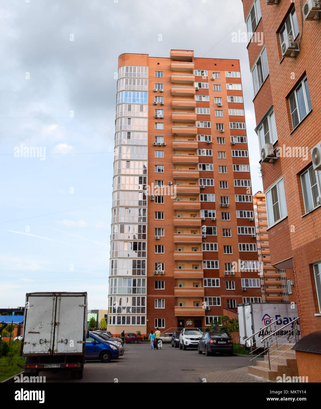 New storey residential building on the city street. Residential houses ...