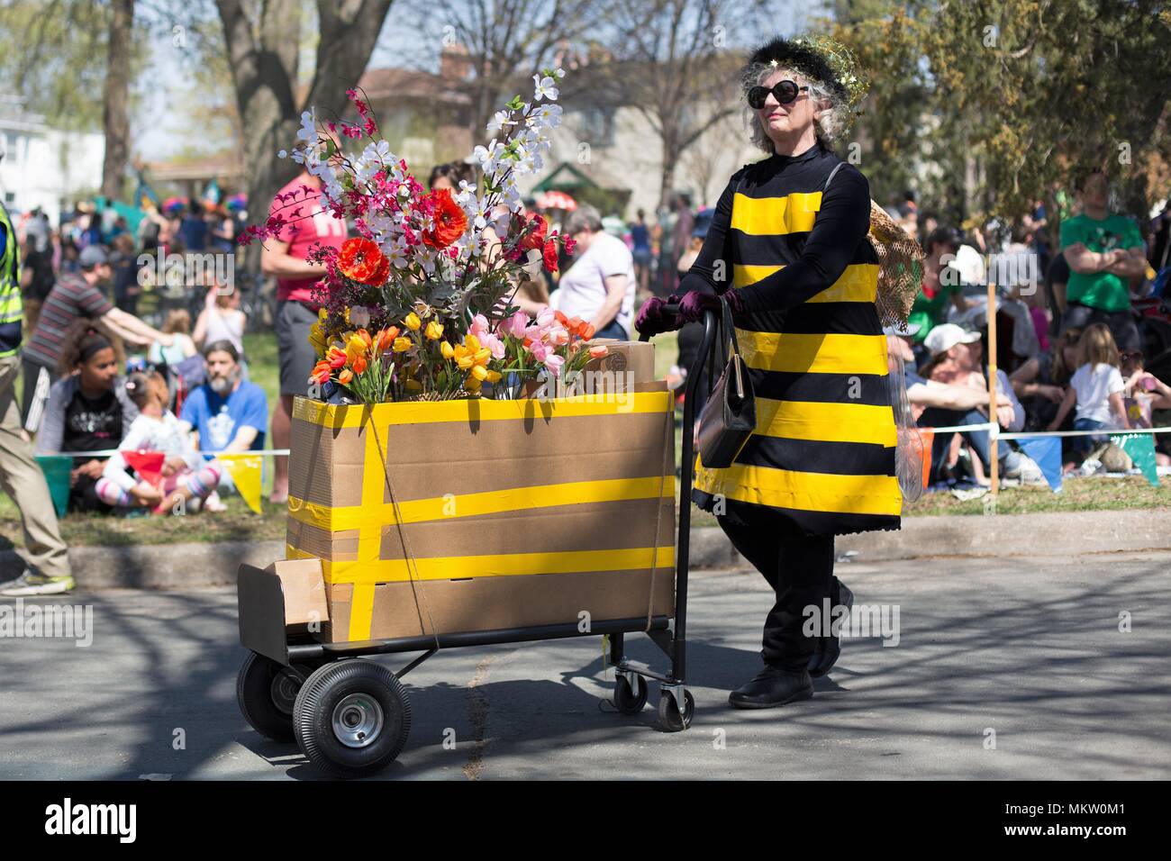 A woman in a bee costume at the May Day parade and festival in ...