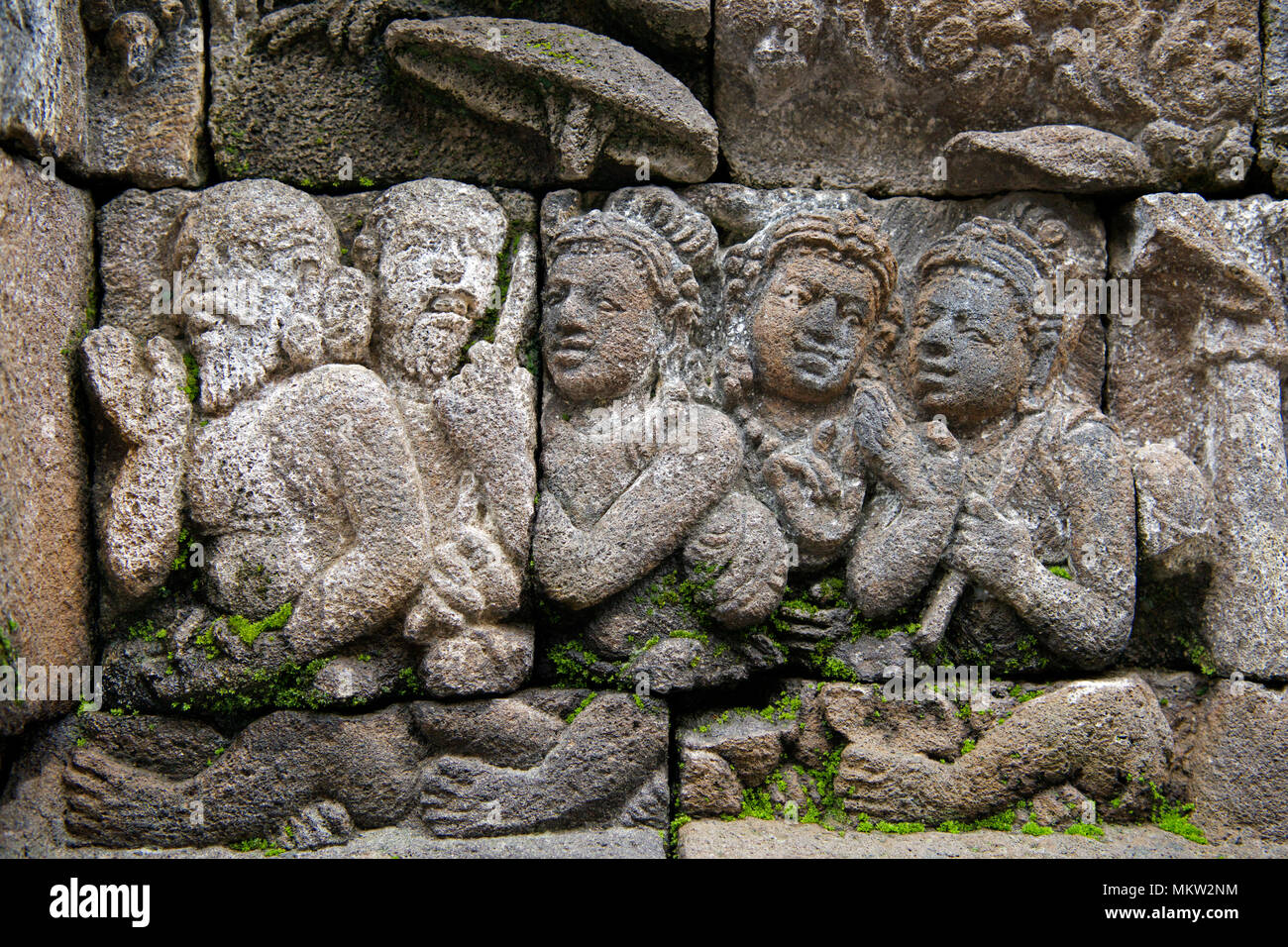 Five figures in stone bas-relief carving Borobudur 9th century Buddhist ...