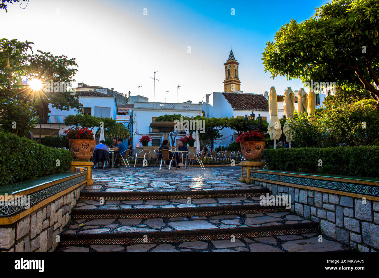 Square. A small square with restaurants and a fountain in Estepona ...