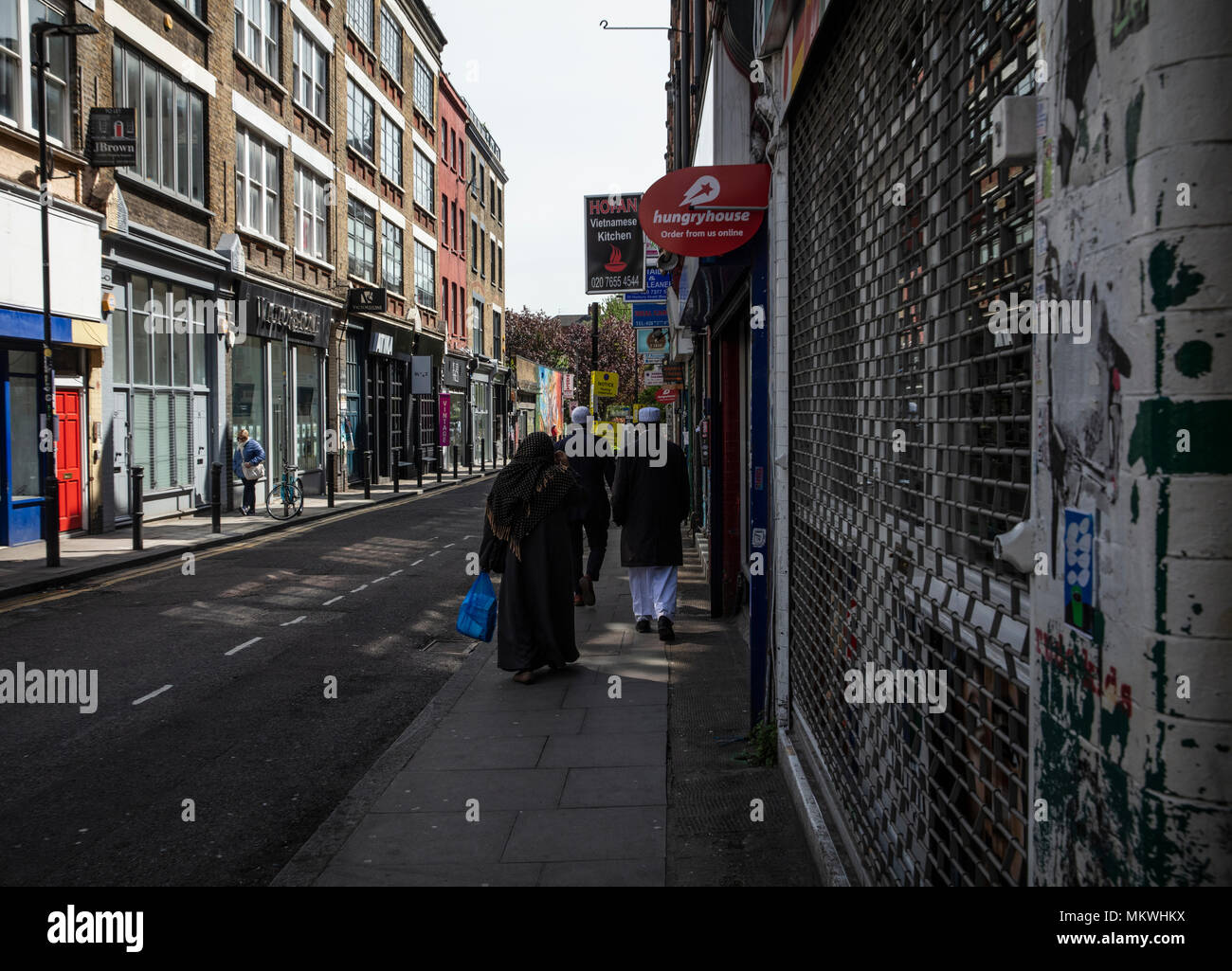 Muslims walking along Brick Lane in East London Stock Photo - Alamy