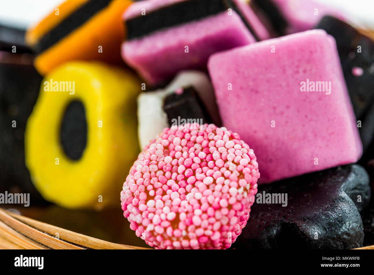 Close up of liquorice allsorts on a white background Stock Photo - Alamy