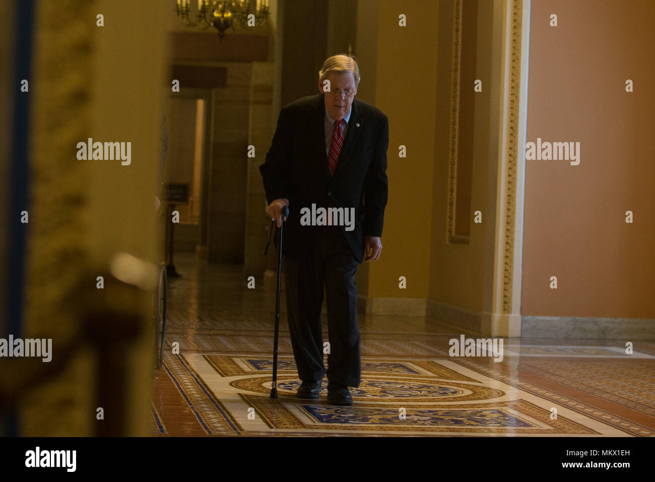 Senator Johnny Isakson (R-GA) walks to the senate floor for votes on ...