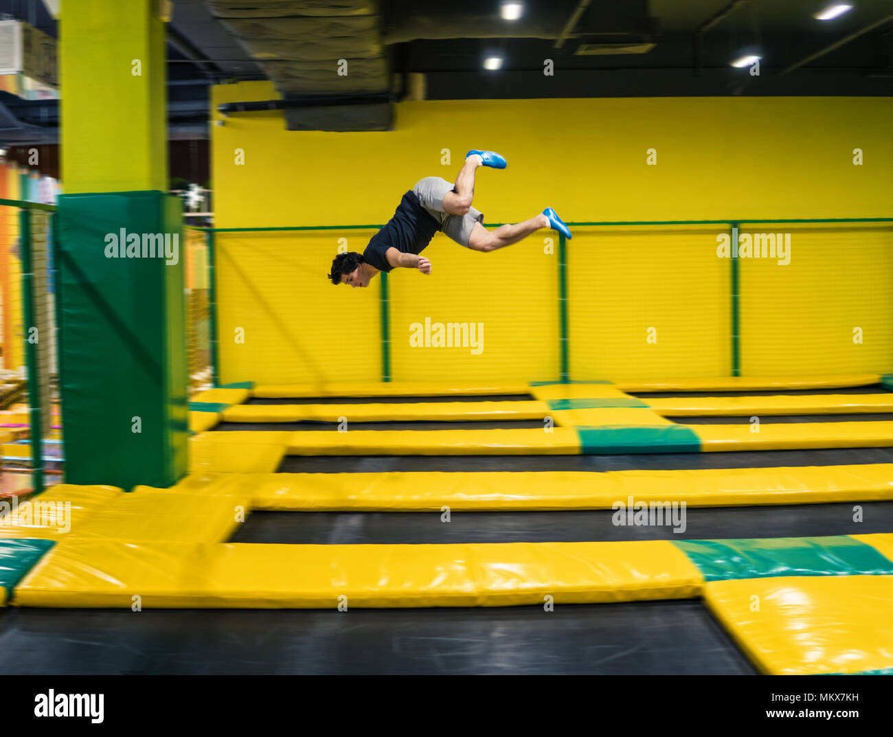 trampoline jumper performs acrobatic exercises on the trampoline Stock ...