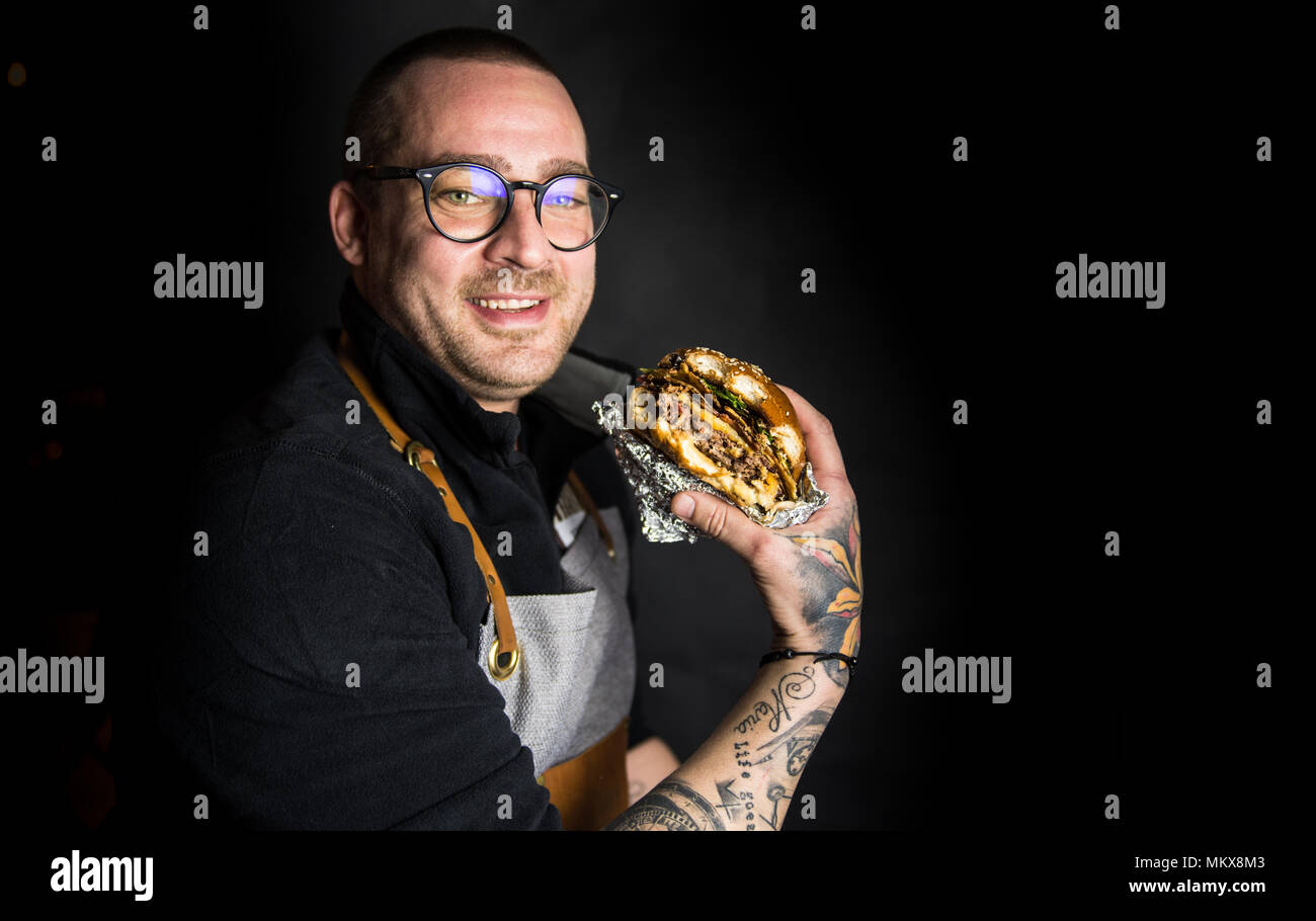Man eating hamburger fries hi-res stock photography and images - Alamy