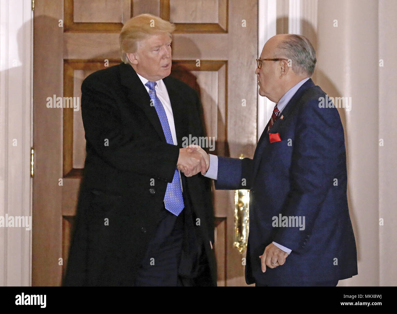 Former New York City Mayor Rudy Giuliani (R) shakes hands with United ...