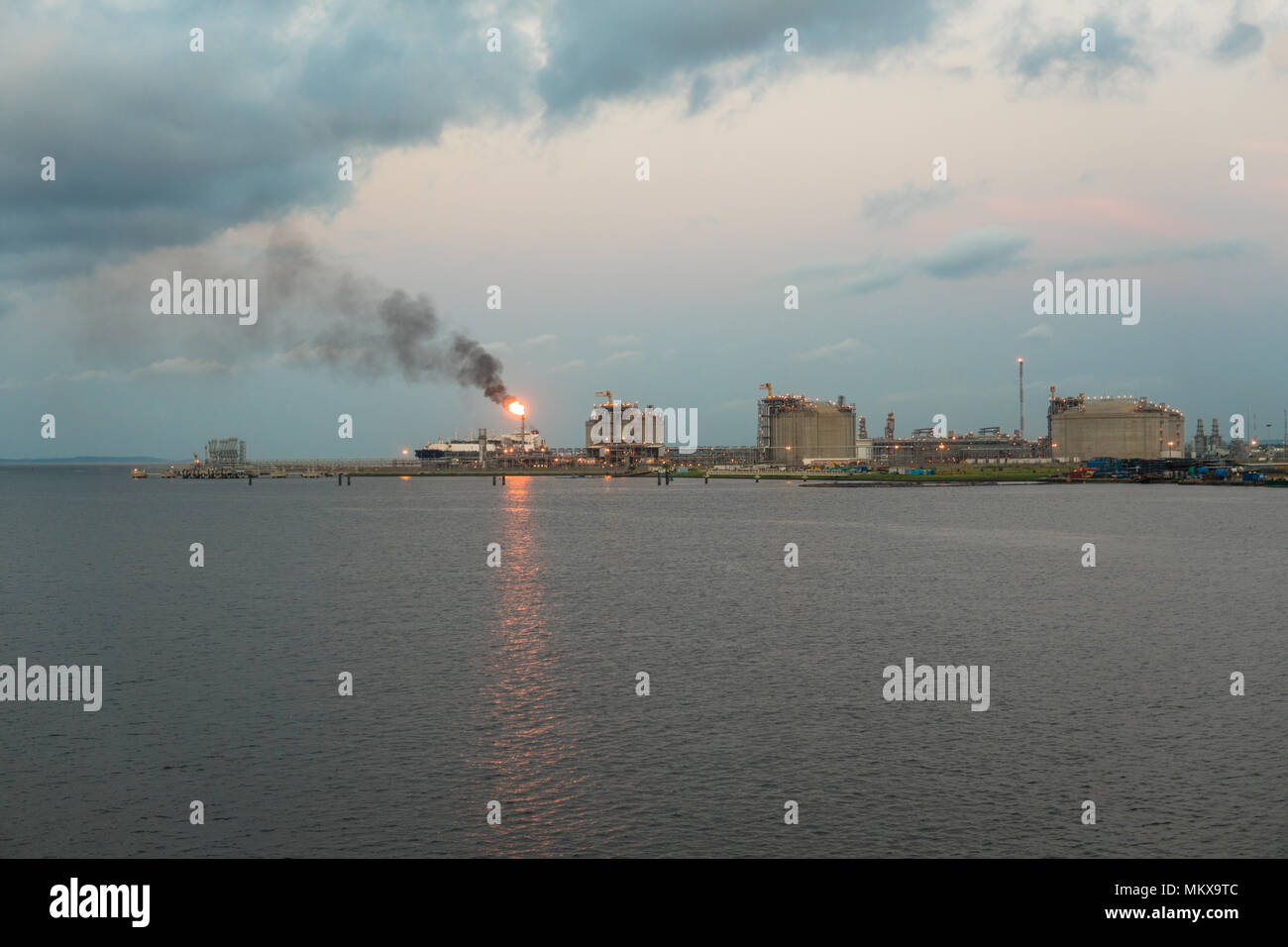Port facility that receives and processes oil and gas. Flare boom is ...