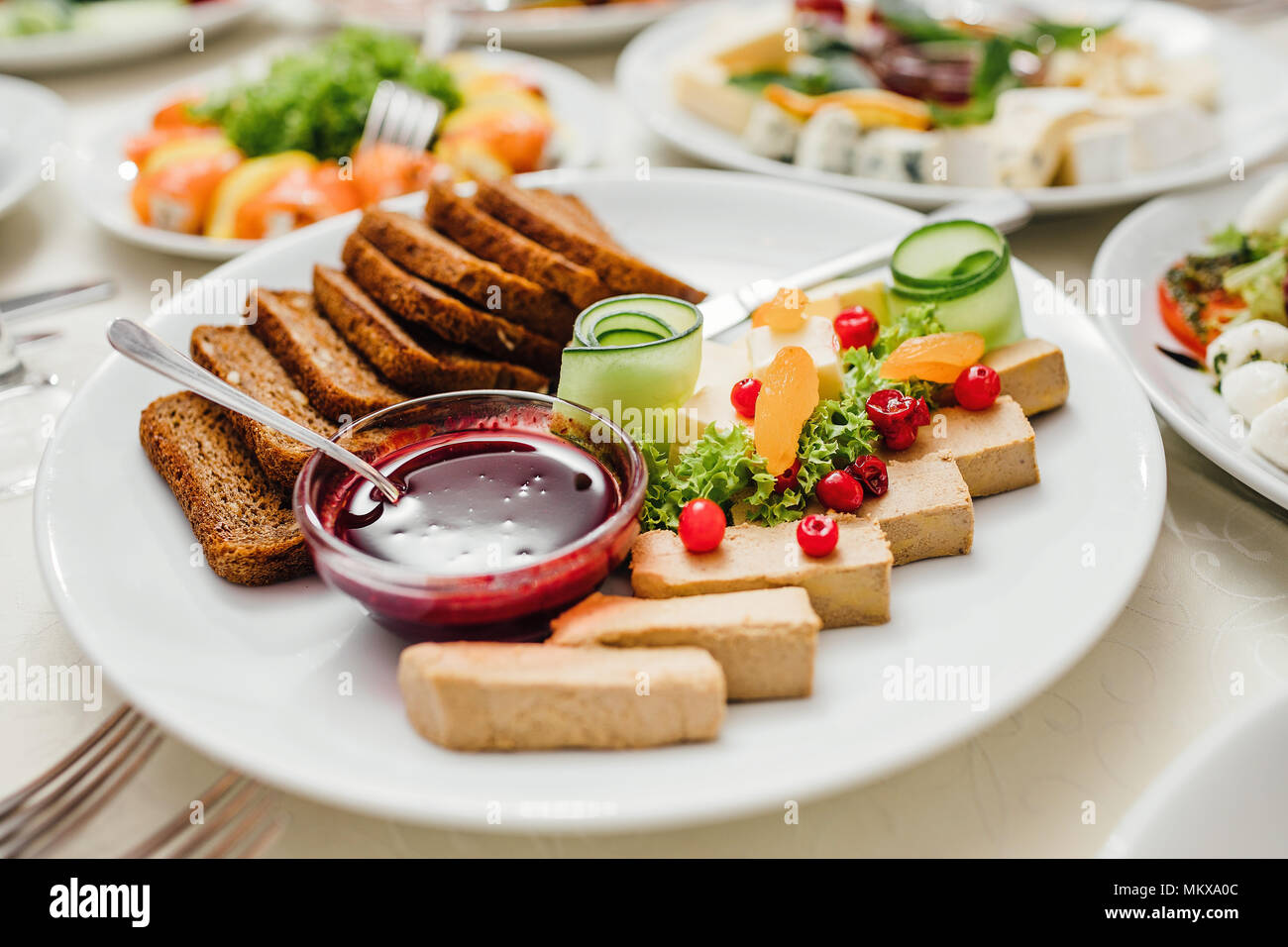 Beautifully decorated catering banquet table with different food snacks ...