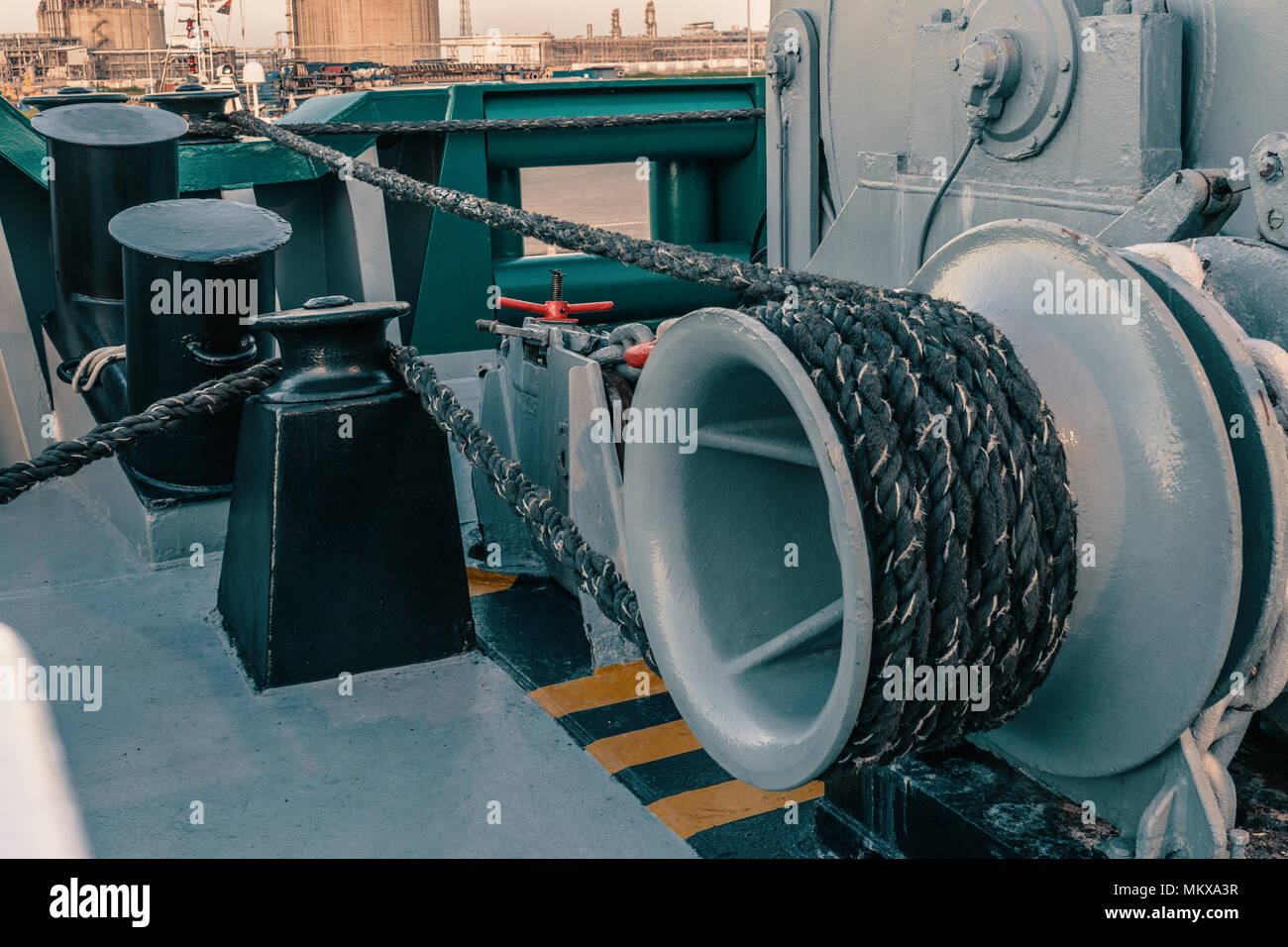 mooring equipment of ship. Mooring lines are fast on bollards, capstan ...