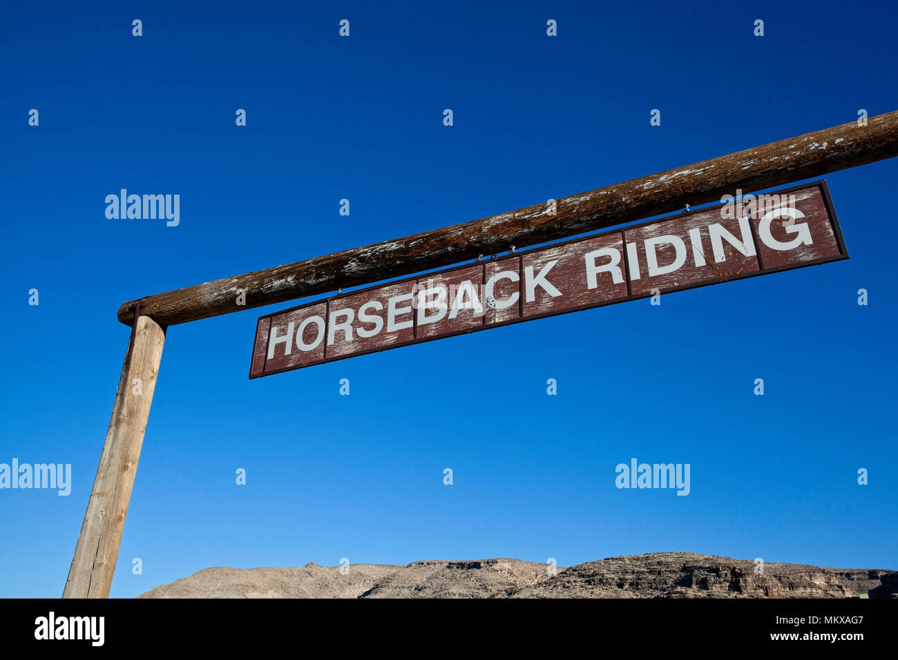 Wooden rustic horseback riding sign at a Nevada dude ranch Stock Photo ...